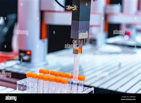 Robot Arm With Test Tube For Biological Experiments In Laboratory Stock