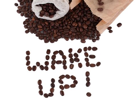 Composición de los granos de café despierta Foto Premium