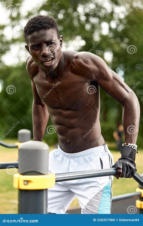 Muscular African American Athlete In With A Naked Sculpted Torso Doing