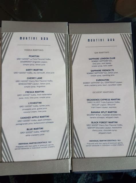 Two Menus Sitting On Top Of Each Other In Front Of A Glass Tablecloth