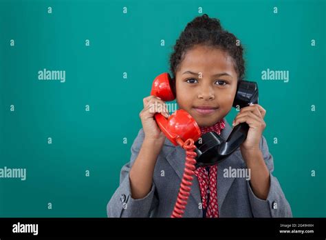 Portrait Of Businesswoman Talking Land Line Phones Stock Photo Alamy