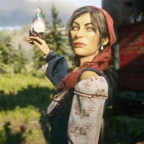 A Woman Holding A Bird In Her Right Hand