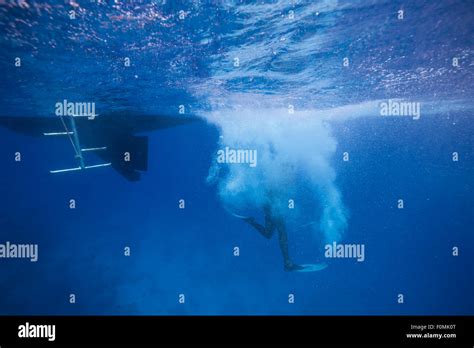 Scuba Diver Jumping Into Water From A Dive Boat Stock Photo Alamy