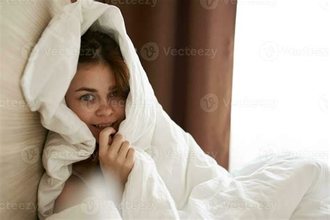 Emotional Woman Hid Under Blanket In Bed Near Window Mobile Phone