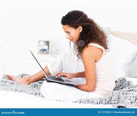 Pretty Woman Working On Her Laptop On Her Bed Stock Photo Image Of