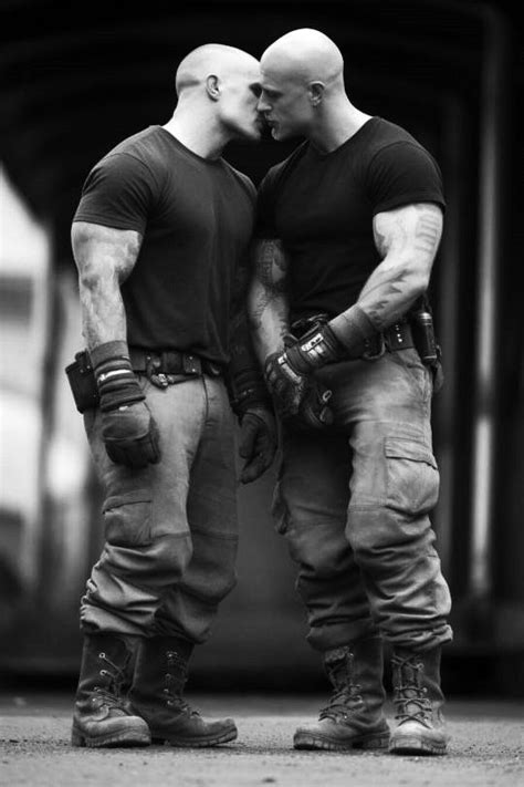 Two Men Standing Next To Each Other With Their Hands On Their Hipss And