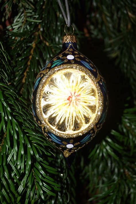 Julekugle 10 cm Oval Blå med spejl og dekoreret med ornament