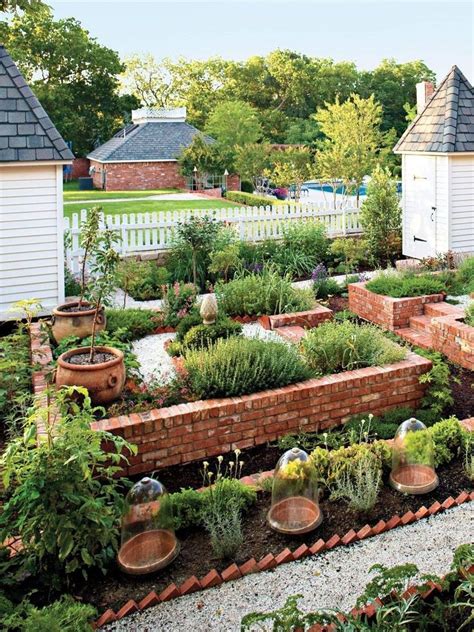 A Garden With Many Different Types Of Plants And Flowers In The Center