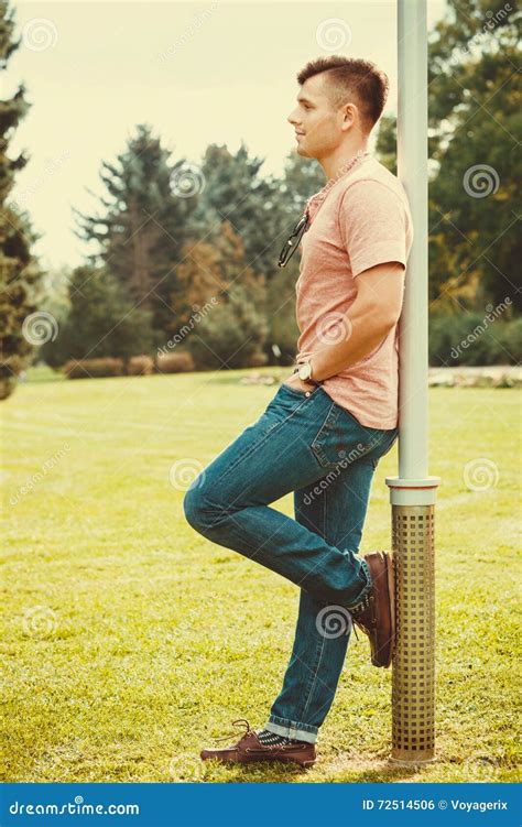 Relaxed Boy Leaning On Pole Stock Photo Image Of Handsome Haircut