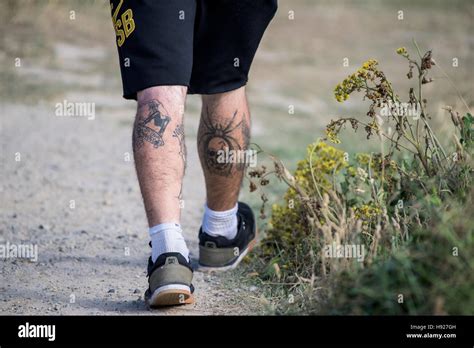 A Man With Tattoos On His Legs Stock Photo Alamy