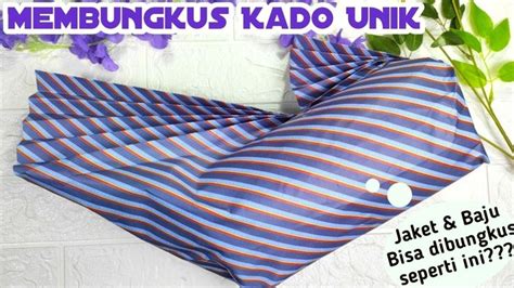 There Is A Blue And Orange Striped Shirt With Buttons On The Front