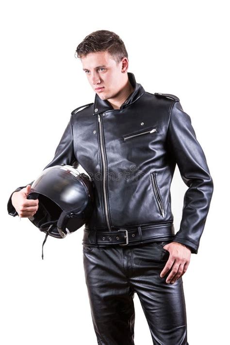 Handsome Biker Man Wearing Black Leather Jacket And Pants Holding