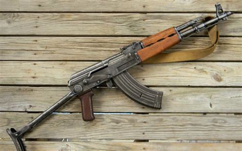 Stunning 4K Ultra HD Wallpaper Of A Man Made AK 47