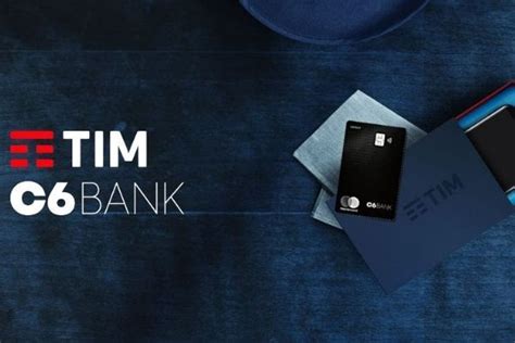 A Credit Card Sitting On Top Of A Blue Towel Next To A Hat And Wallet
