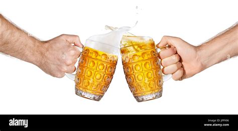 Two Mugs Of Beer Toasting Creating Splash Isolated On White Background