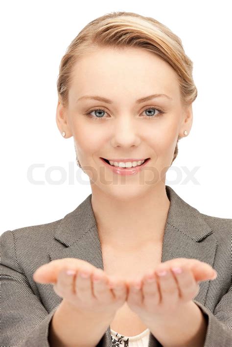 schöne Frau zeigt etwas auf der flachen Hand Stock Bild Colourbox