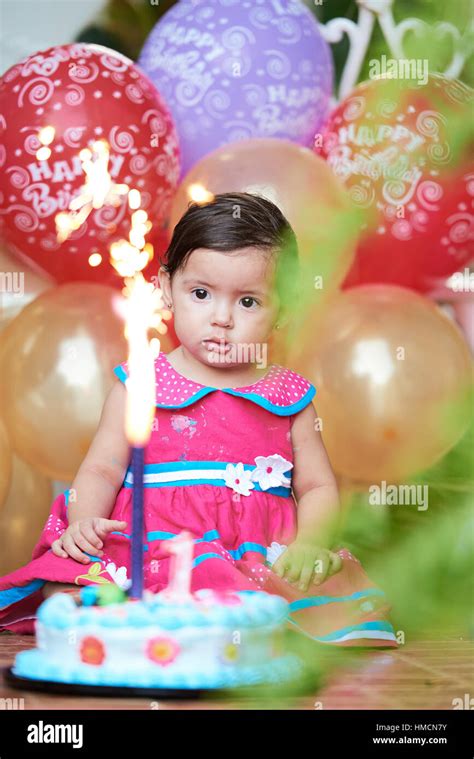 Baby Look On Birthday Cake With One Candle Stock Photo Alamy