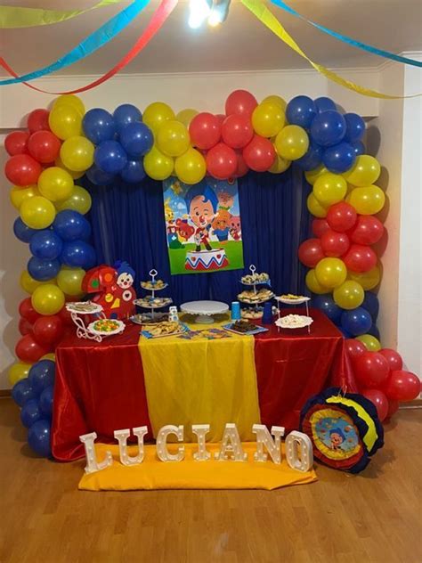 A Birthday Party With Balloons And Decorations