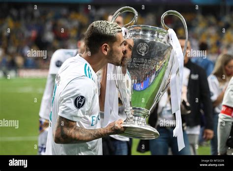 Theo Hernandez Of Real Madrid Celebrates With The Trophy After The UEFA