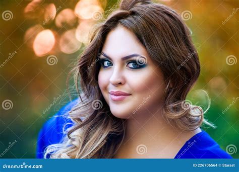 Happy Plus Size Model With Professional Hairstyle And Makeup Outdoors