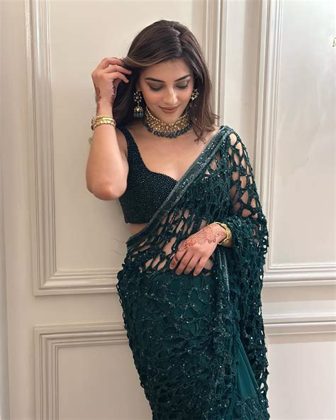 Mehreen Pirzada Hot Photoshoot In Sleeveless Transparent Saree