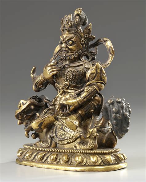 A Sino Tibetan Gilt Bronze Figure Of Jambhala