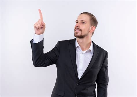 Hombre De Negocios Guapo Vestido Con Traje Mirando A Un Lado Apuntando
