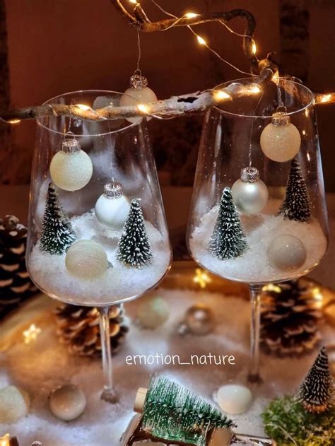 Two Wine Glasses Filled With Snow And Christmas Decorations