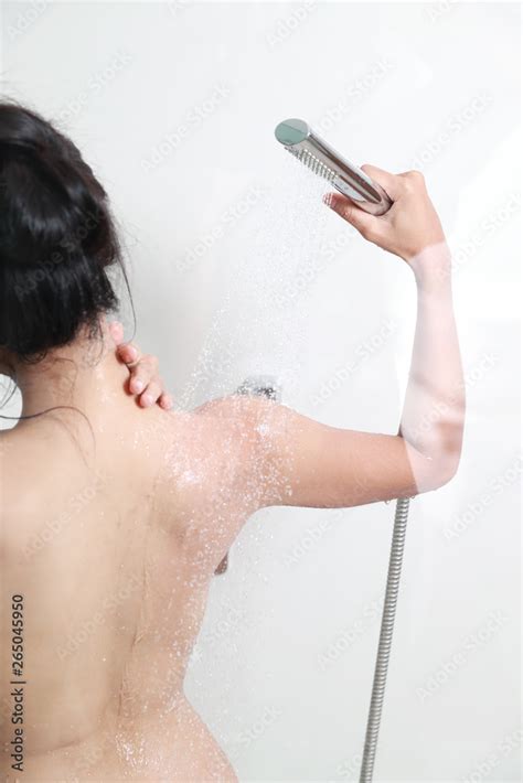 Portrait Of Beautiful And Sexy Woman Taking Shower From Back View With