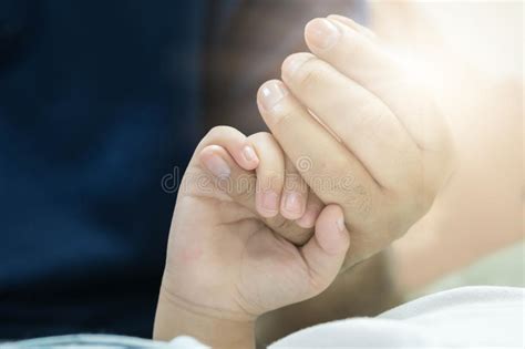 Closeup Father And Son Hold Hands With Love Stock Photo Image Of