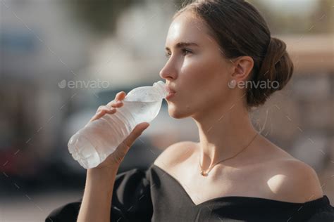 Close Up Portrait Of A Beautiful Young Girl Drinking Water From The Bottle Street Portrait