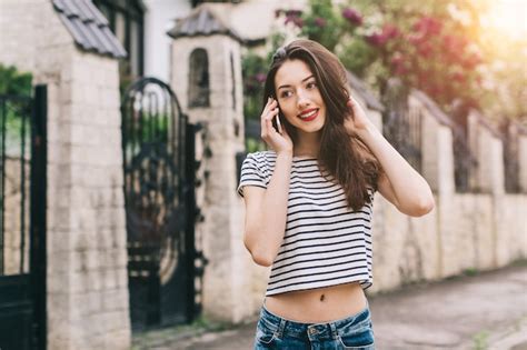 Premium Photo Woman Wearing Striped T Shirt With Her Mobile