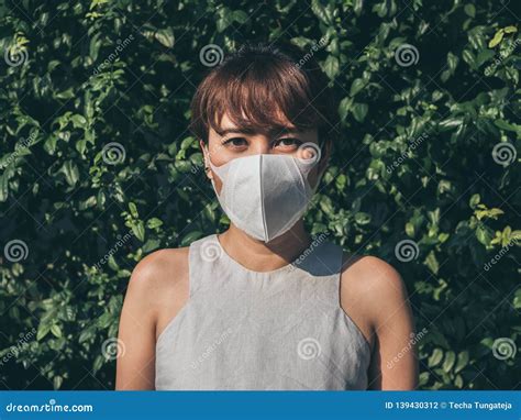 Beautiful Asian Woman Wearing White Protective N Mask Stock Photo