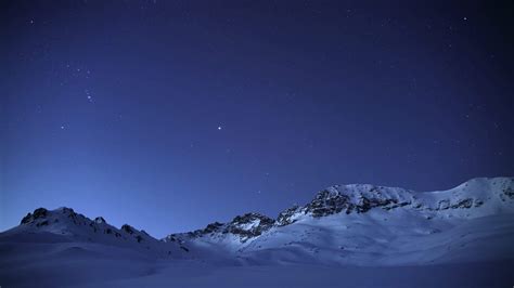K Transition From Starry Night To Day In Snowy Mountains At Morning