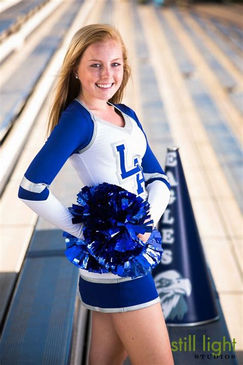 Creative Senior Portrait Idea Capturing The Spirit Of Cheerleading In Stands