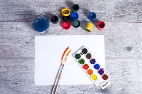 Premium Photo Set Of Watercolor Paints And Brushes For Painting