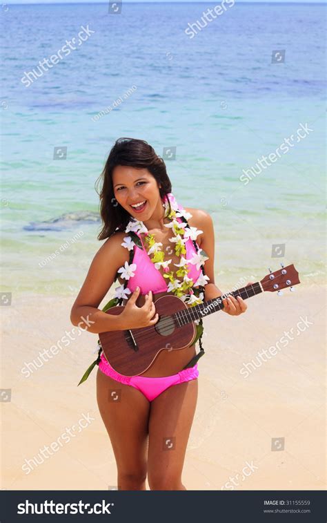 Beautiful Polynesian Girl With Flower Lei In A Pink Bikini Standing On