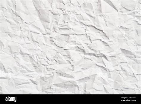 White Crumpled Paper Texture With Wrinkles Damaged And Torn Sheet