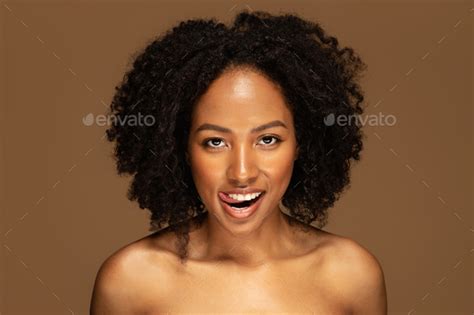 Portrait Of Hot Naked Black Lady Posing On Brown Background Stock Photo