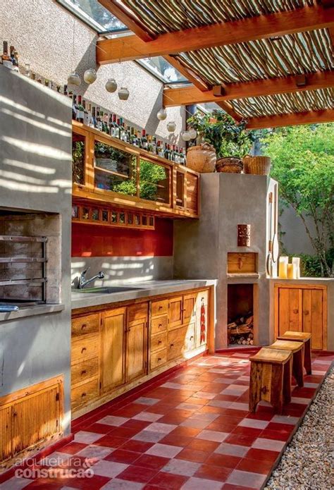 Espaço gourmet contemporâneo concreto aparente e ilha em Perla