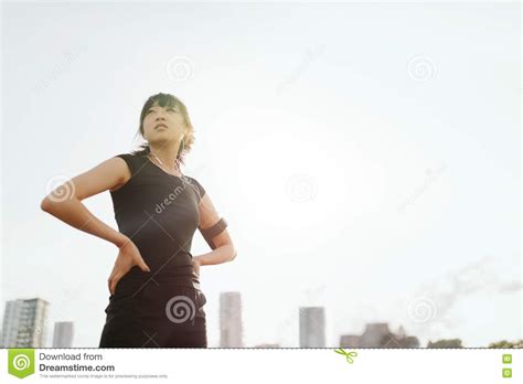 Fitness Woman Standing With Her Hands On Hips And Looking Away Stock Image Image Of Looking