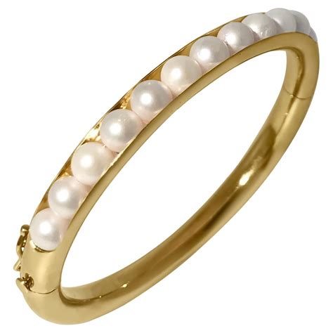 14 Karat Yellow Gold Oval Bangle Bracelet With T Pearls By Manart For