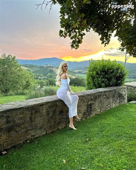 Khloe Kardashian Flaunts Her Curves In A White Dress Photos