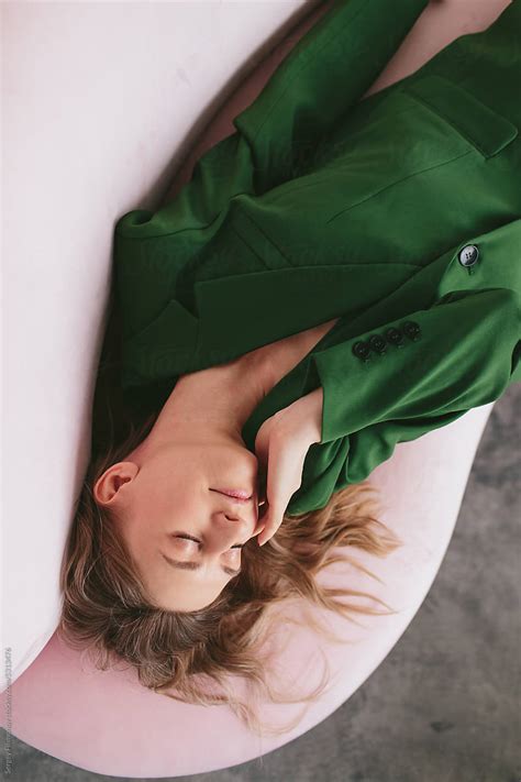 Relaxed Woman Lying On Sofa With Closed Eyes Del Colaborador De