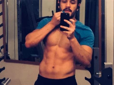 Flaunting His Six Pack Abs In The Gym