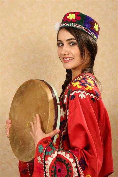 BEAUTIFUL TAJIK GIRL IN NATIONAL DRESS OF TAJIKISTAN