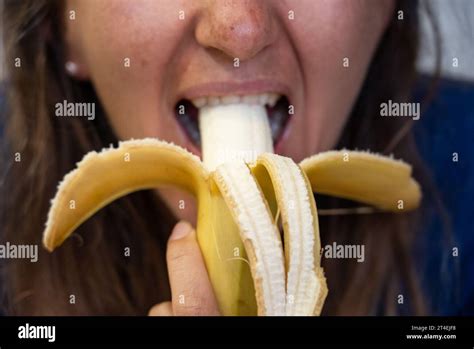 Woman Eats Food Woman Eats Banana Close Shot Of Girl Eating Bananas Face While Eating Banana