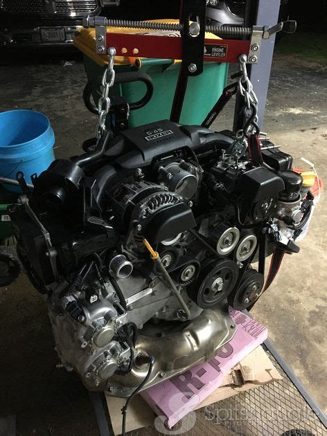 An Engine Is Being Worked On In A Garage