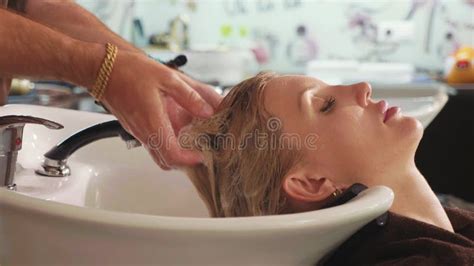 Male Stylist Washing A Blond Woman`s Head In A Modern Beauty Salon Stock Footage Video Of Head