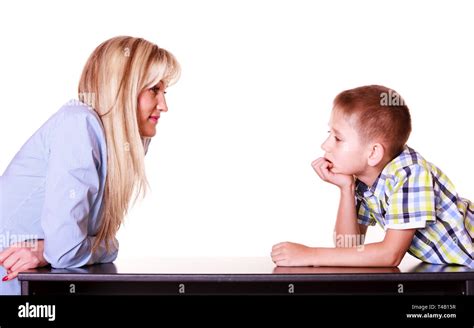 Relationships Arguments And Discussion Mother And Son Sit At Table And